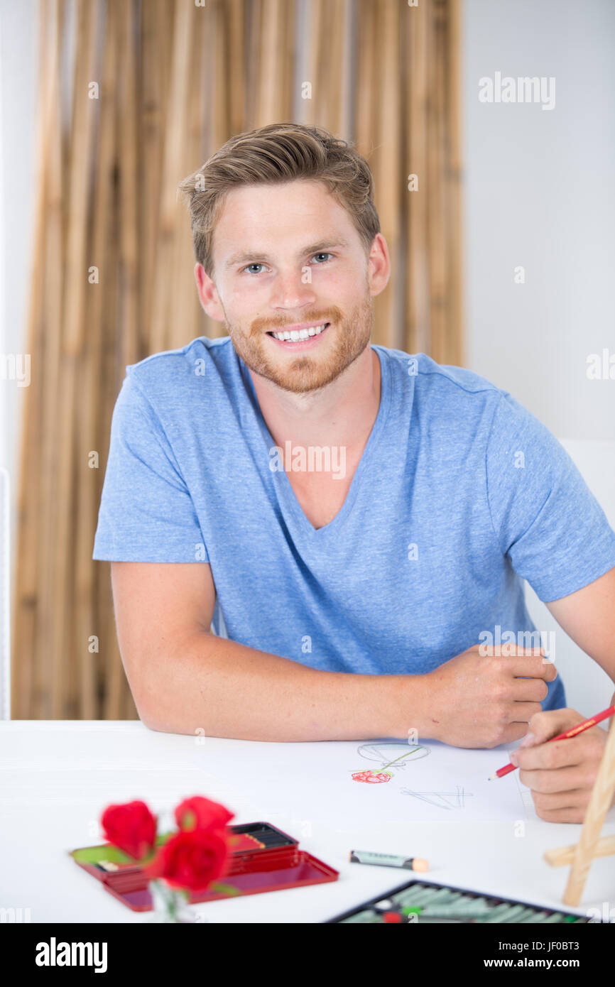 Portrait of young man drawing still life Stock Photo - Alamy