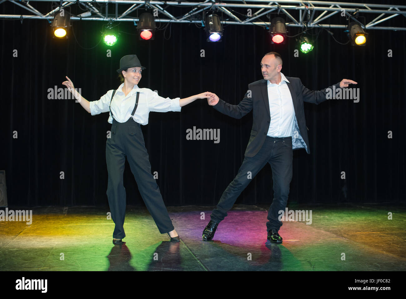 Couple dancing on stage Stock Photo - Alamy