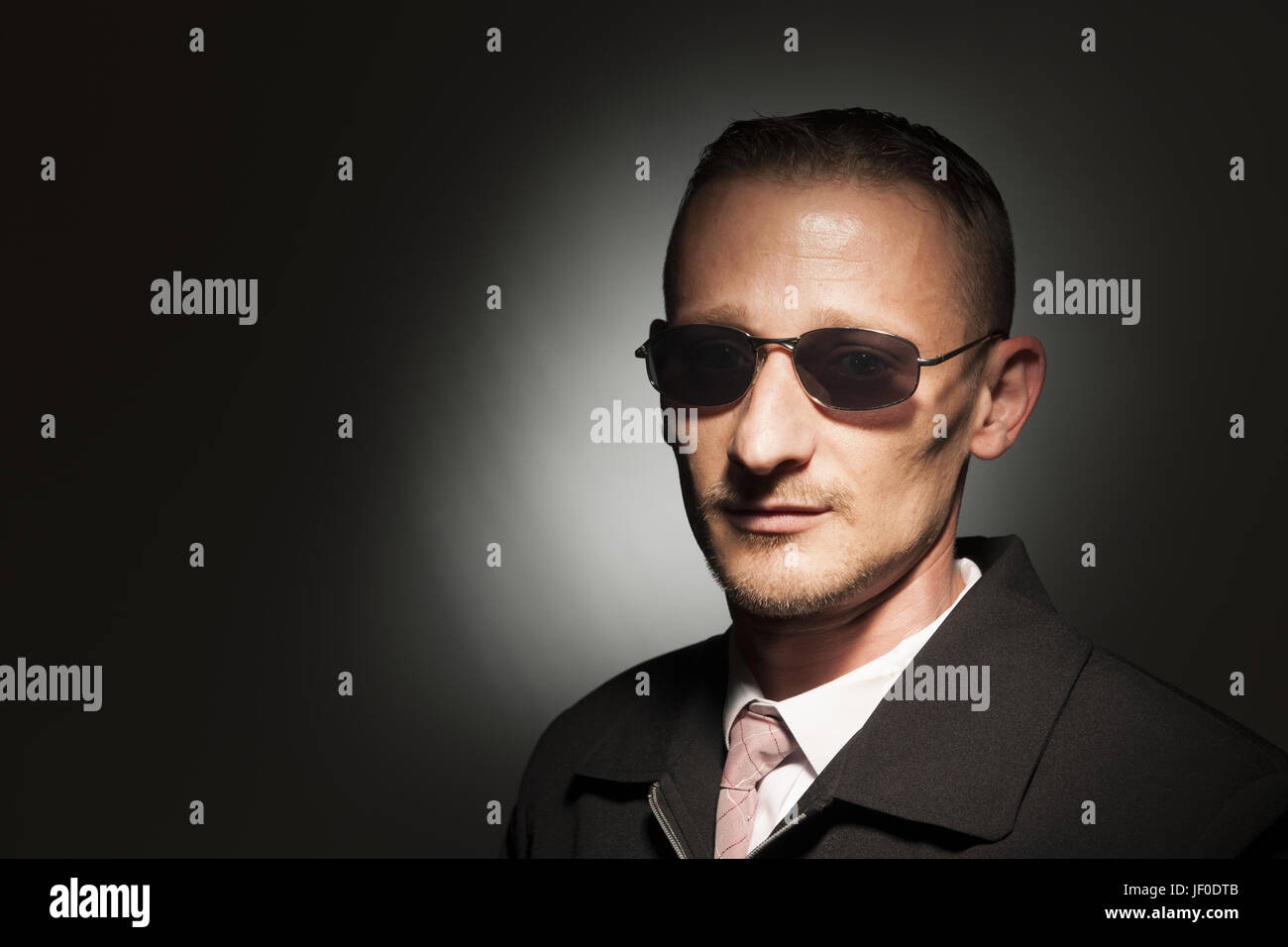 man with sunglasses in the spotlight Stock Photo - Alamy