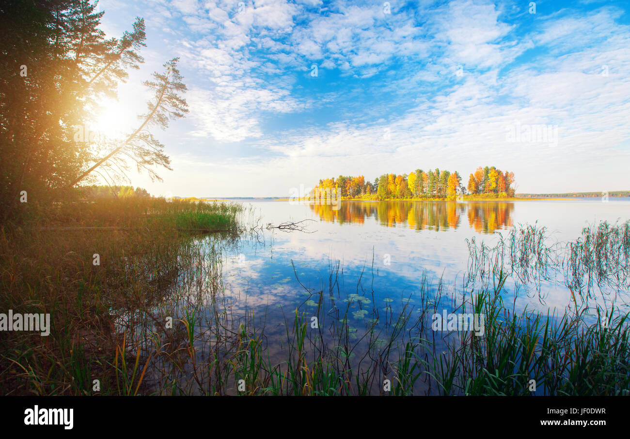 Autumn island and lake Stock Photo - Alamy