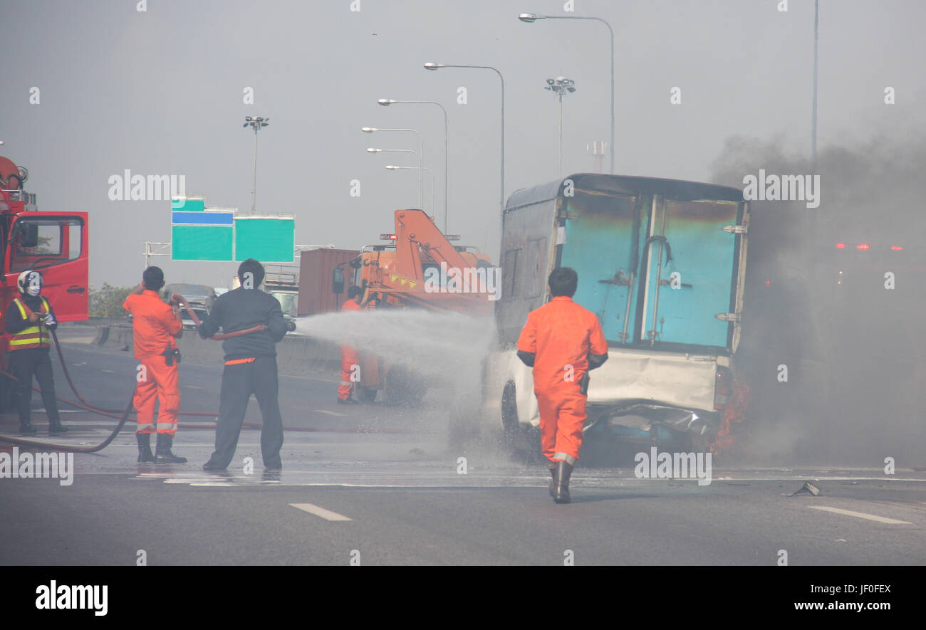 Firefighter fire brigade small truck car crash on motorway street Stock ...