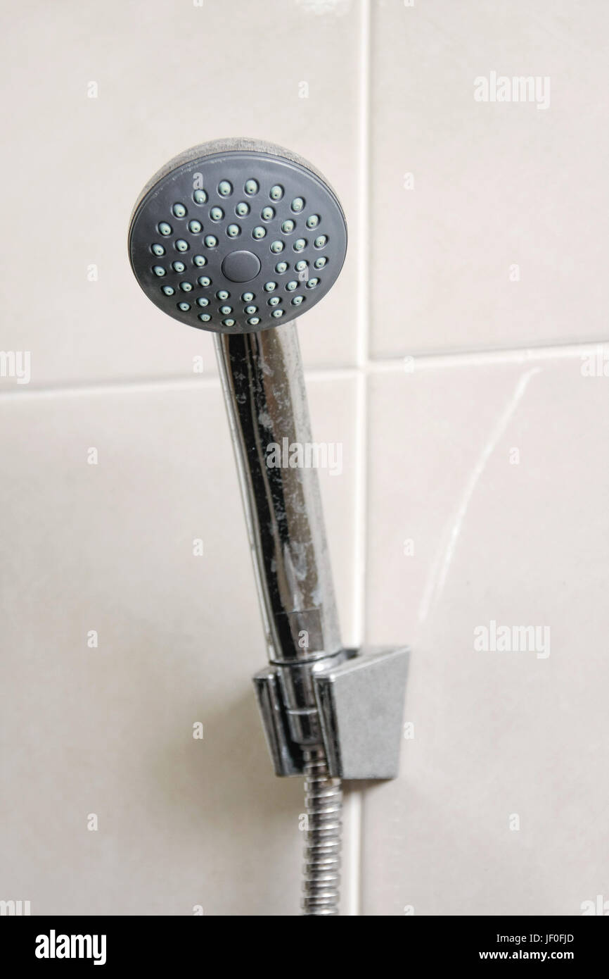 head shower hanging in tile wall of bathroom Stock Photo - Alamy