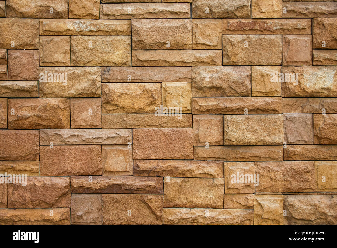 orange brick stone texture wall, exterior background Stock Photo - Alamy