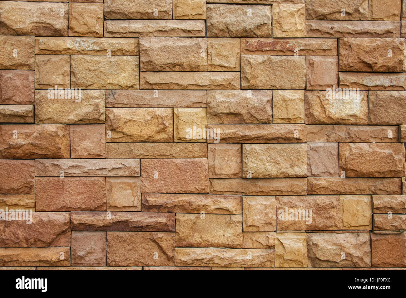 orange brick stone texture wall, exterior background Stock Photo - Alamy