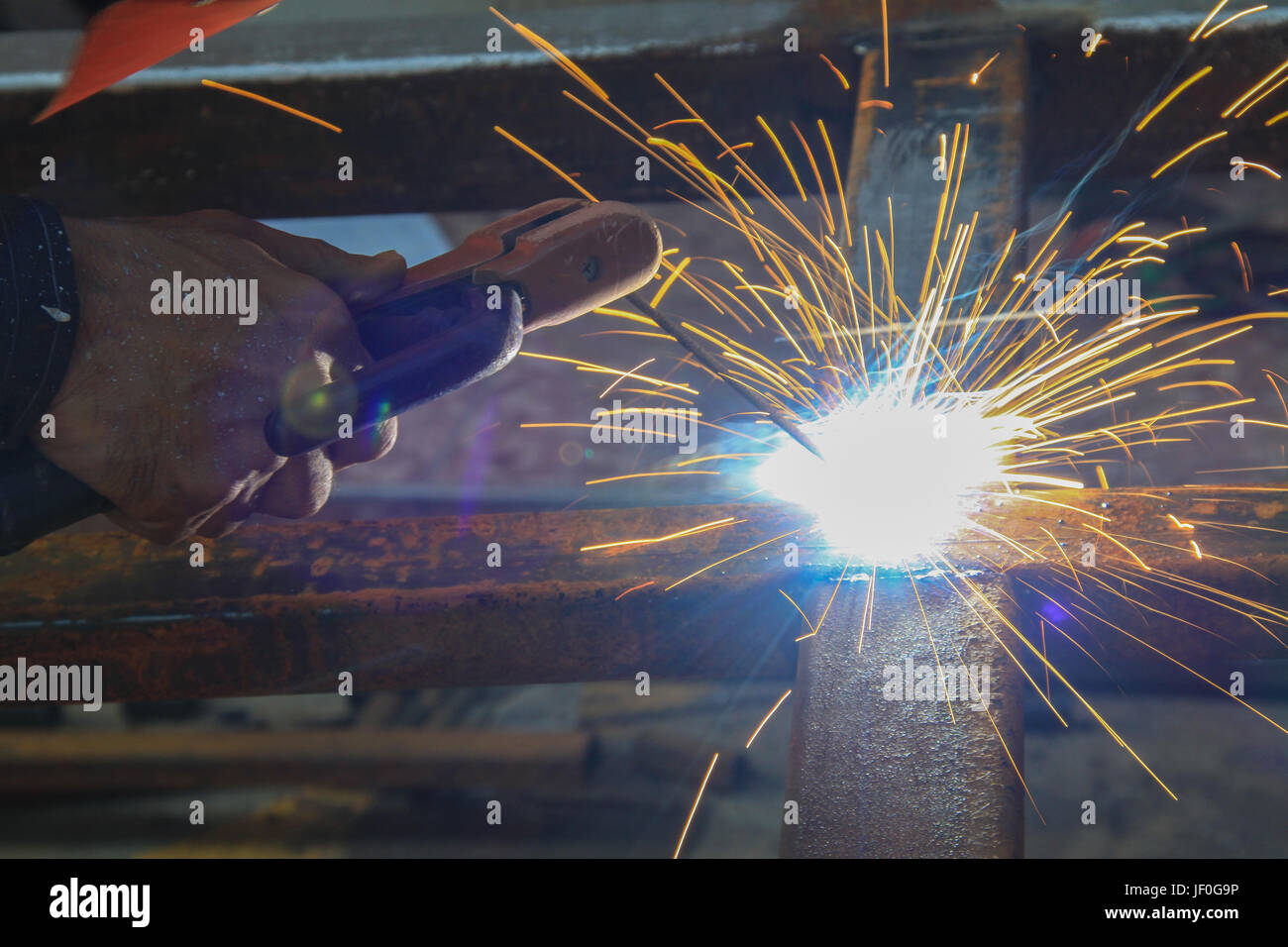 welding steel with sparks lighting Stock Photo - Alamy