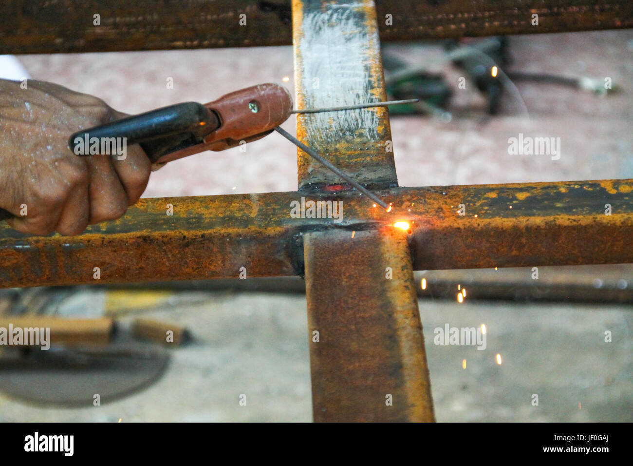 welding steel with sparks lighting Stock Photo - Alamy