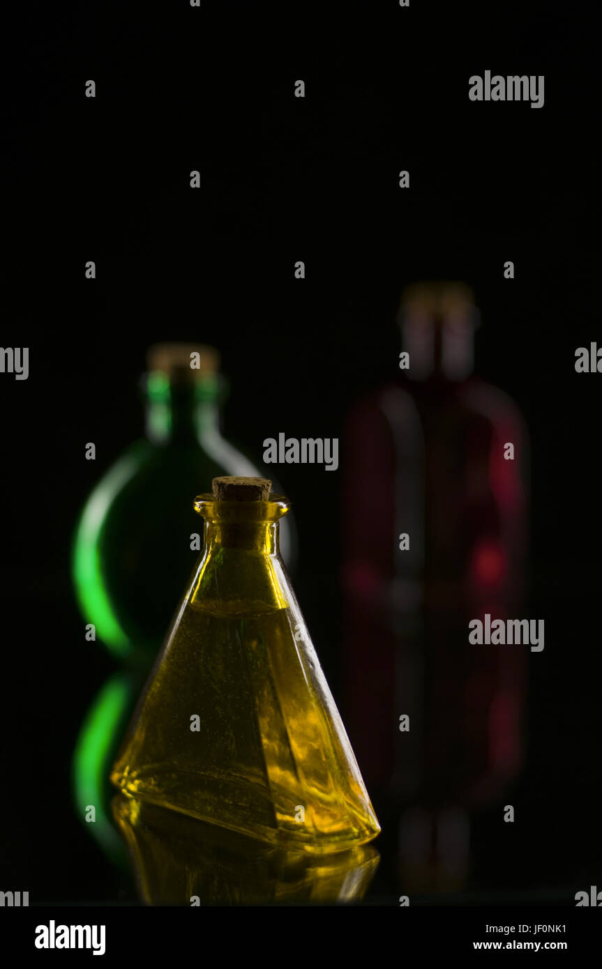 three bottles on black Stock Photo - Alamy