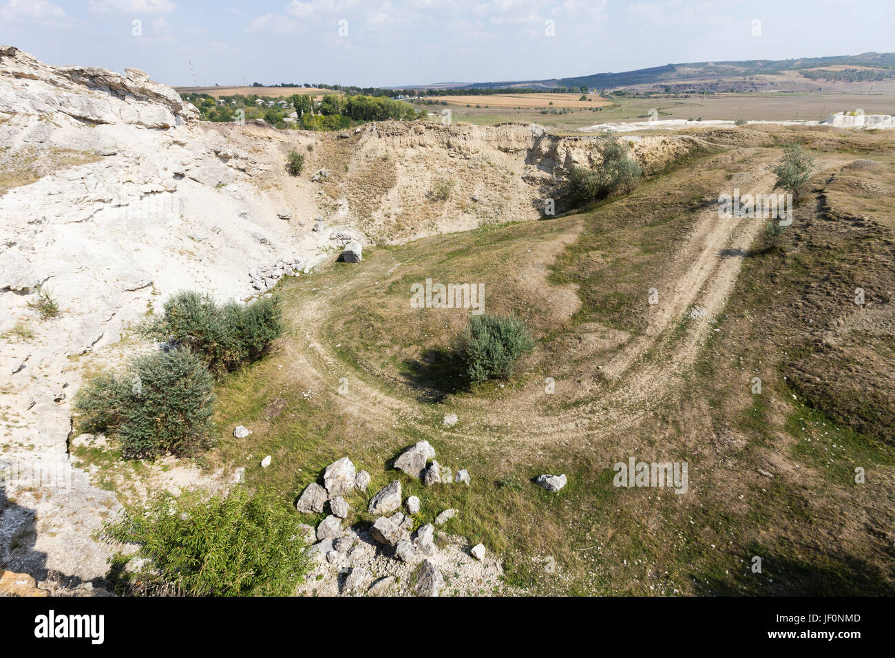 View of the abandoned quarry. Rock and trees in the country Stock Photo ...