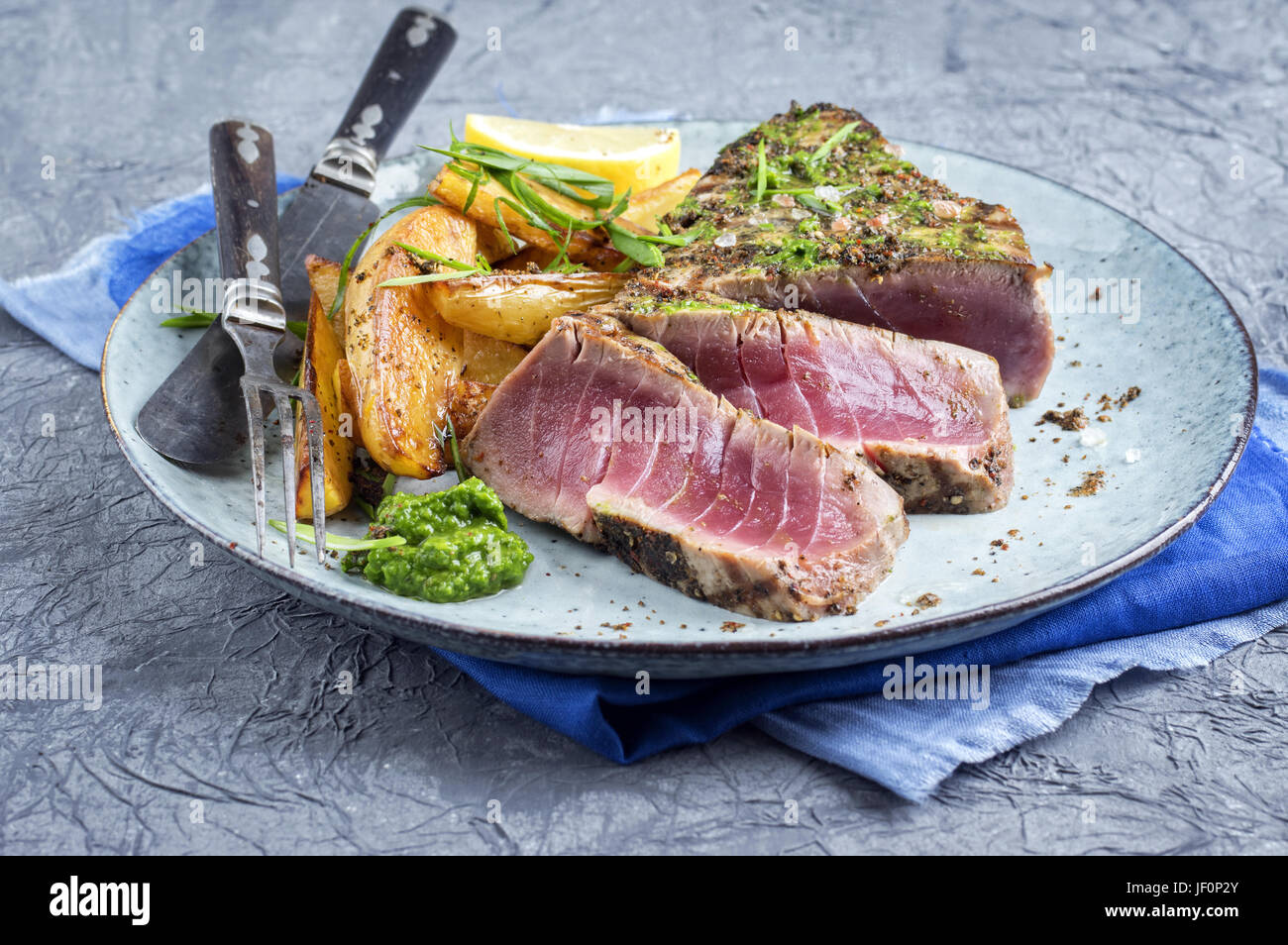 Tuna Steak with Home Fries Stock Photo - Alamy