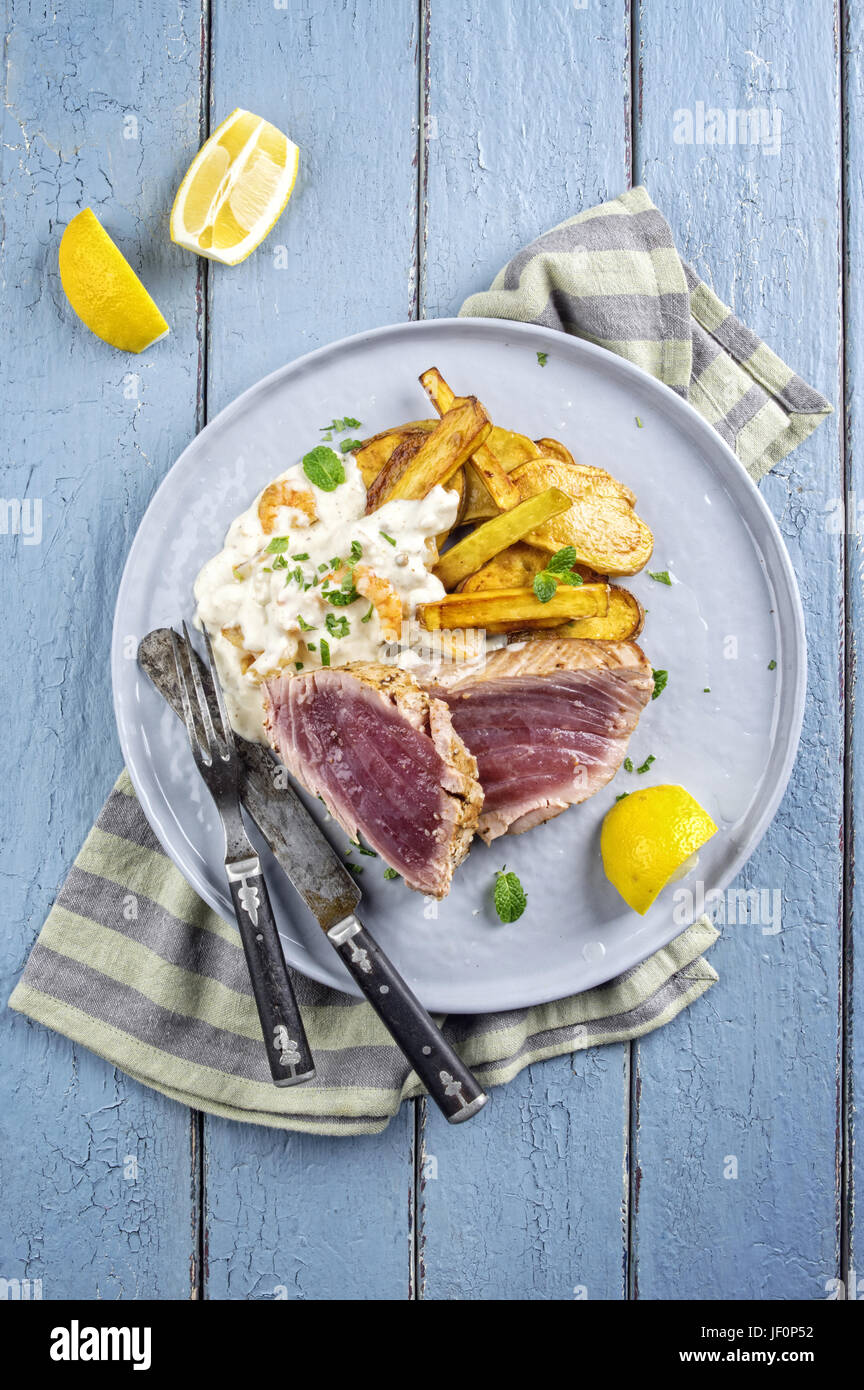 Tuna Steak with Home Fries Stock Photo - Alamy
