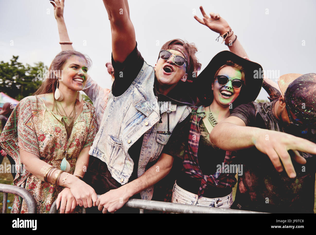 Group of friends dancing in front of stage Stock Photo - Alamy