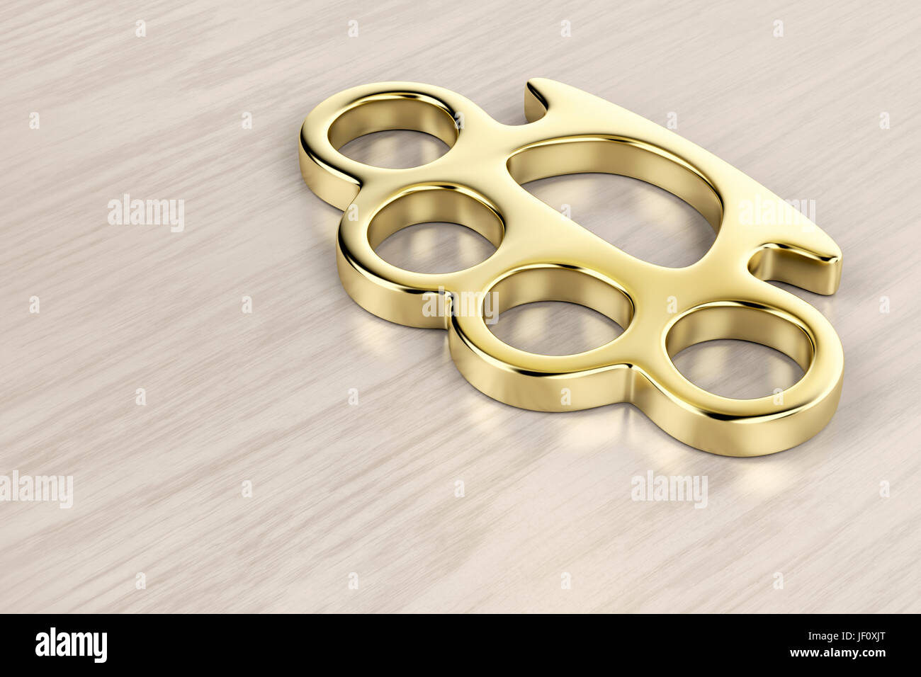 Golden brass knuckles on wooden background Stock Photo - Alamy
