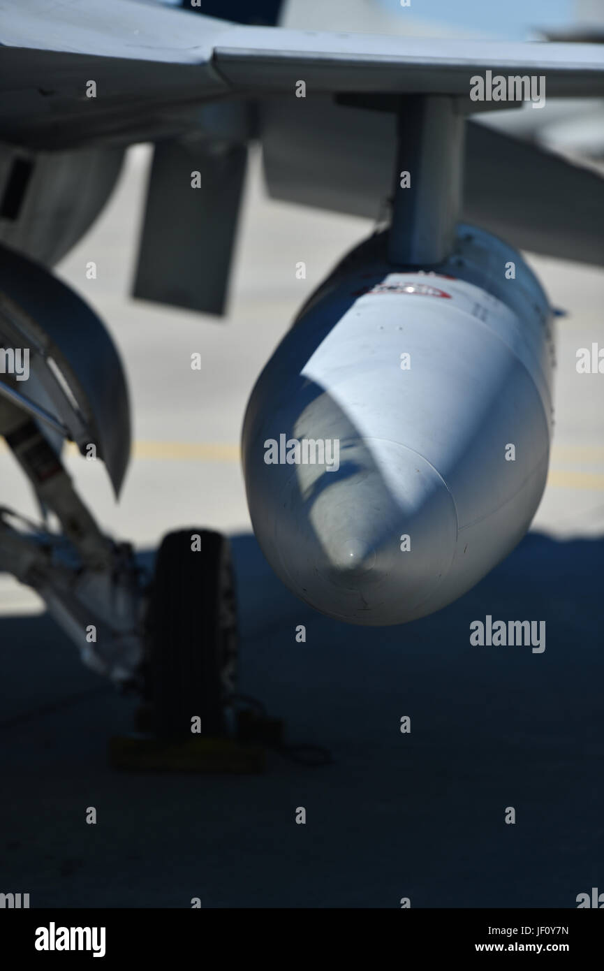 Fighter aircraft with ammunition and missiles on the runway Stock Photo ...