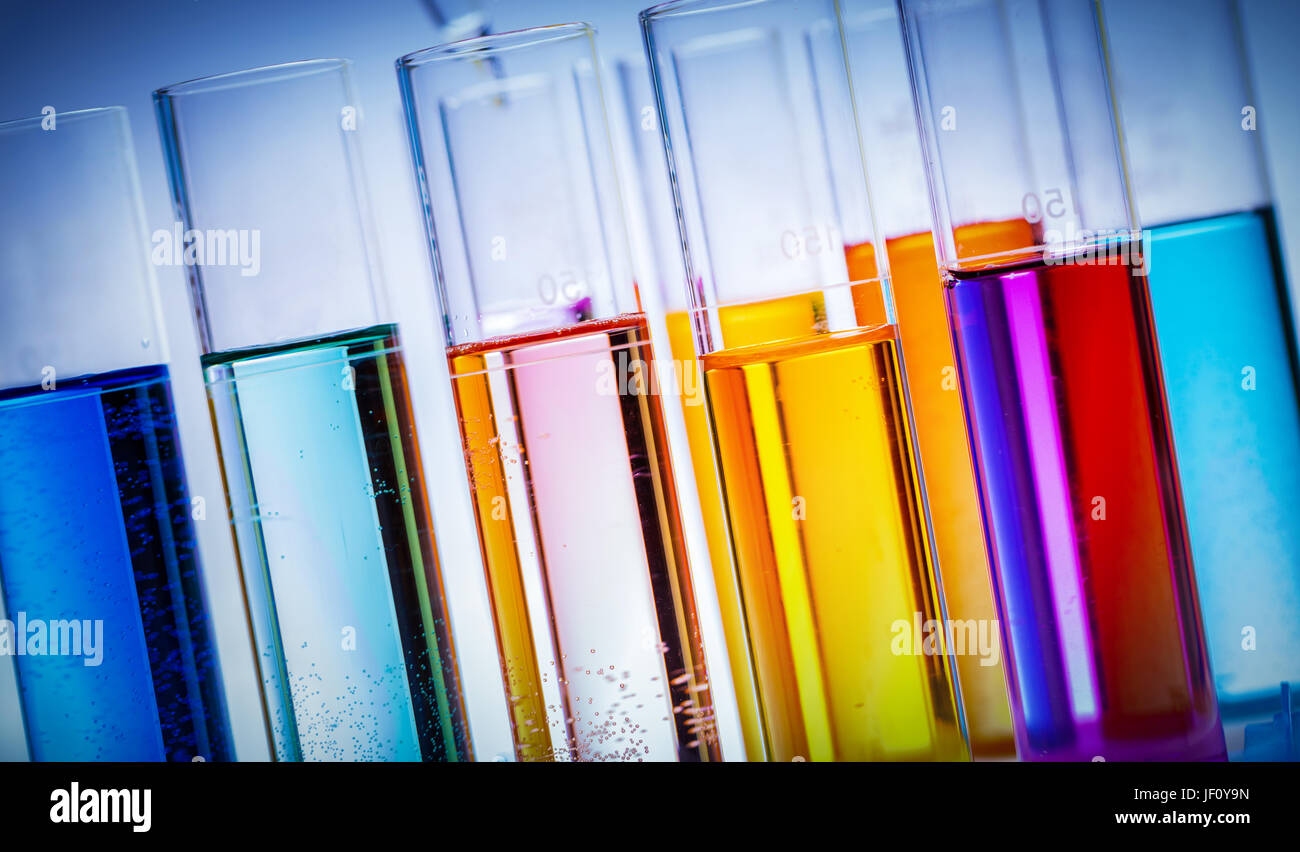 Group of testing tubes filled with colored liquids in a laboratory ...