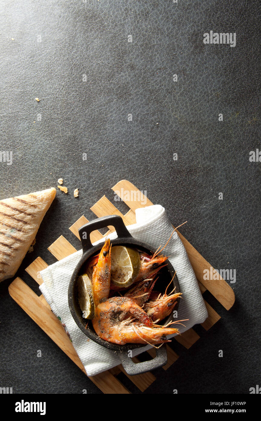 Large cooked prawns with toasted bread Stock Photo - Alamy