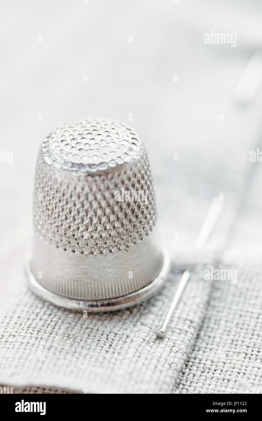 Metal thimble, close-up Stock Photo - Alamy