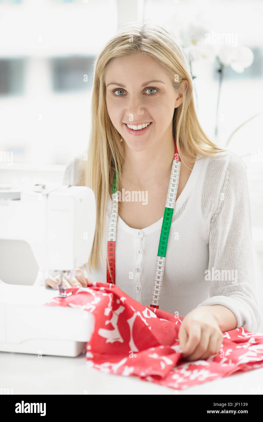 Young woman sewing Stock Photo - Alamy