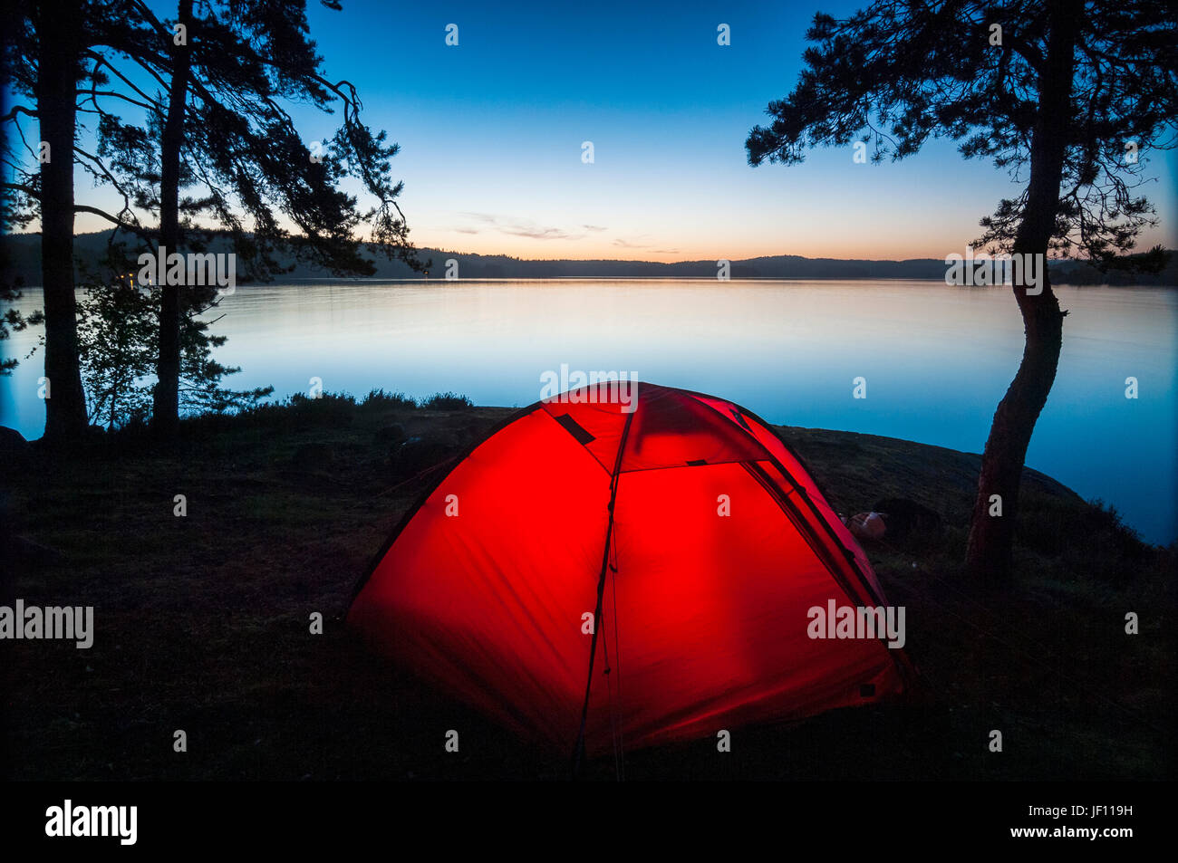 Red tent at dusk Stock Photo - Alamy