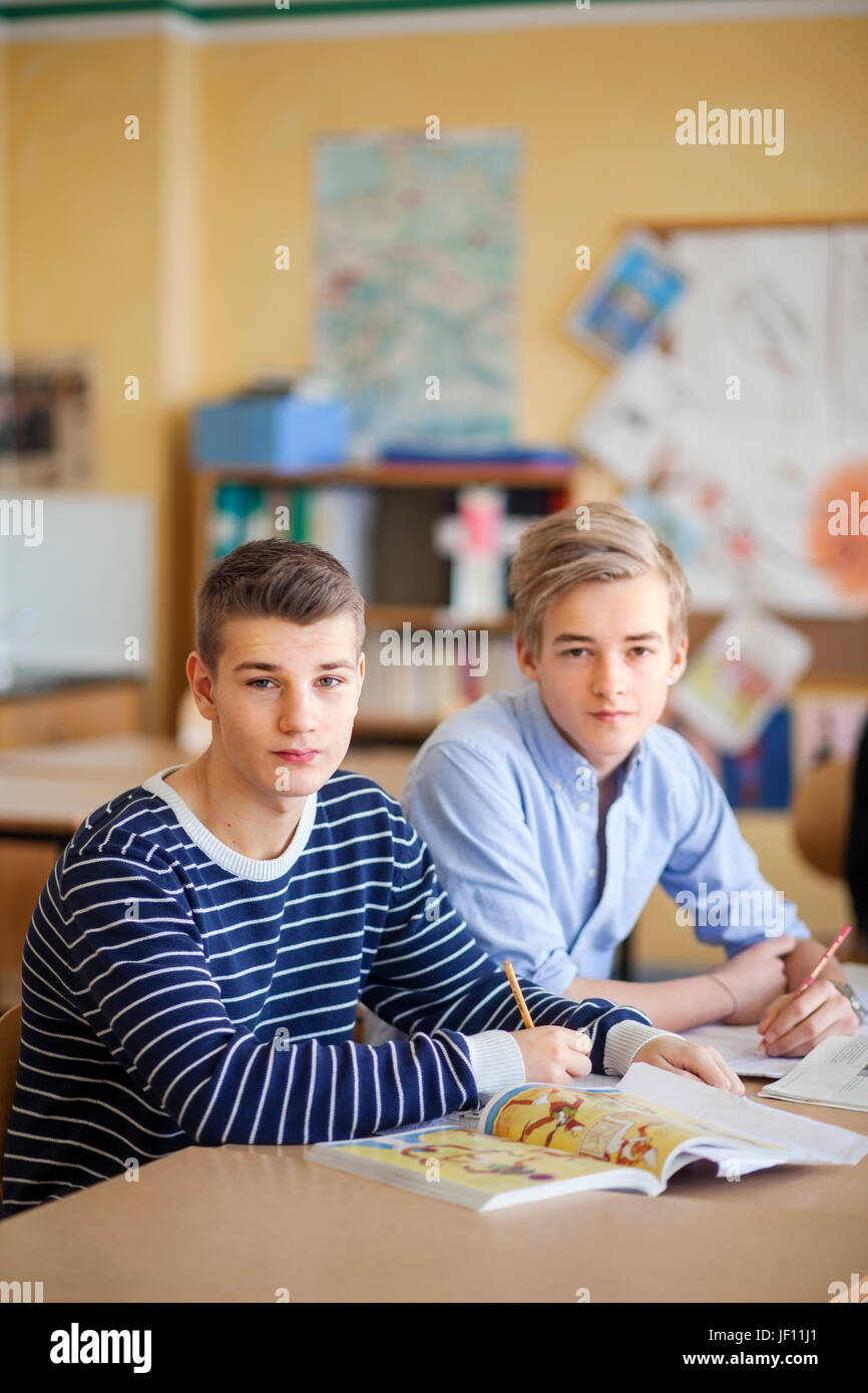 Teenage boys in classroom Stock Photo - Alamy