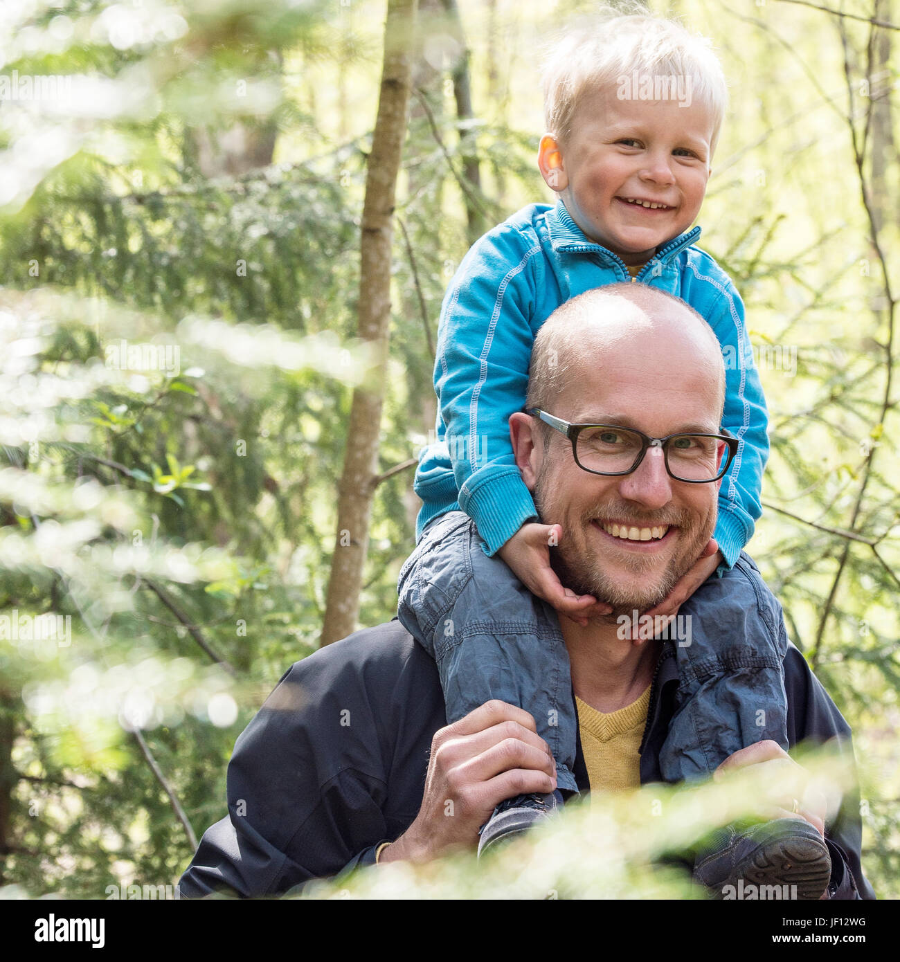 Father carrying son on shoulders Stock Photo - Alamy