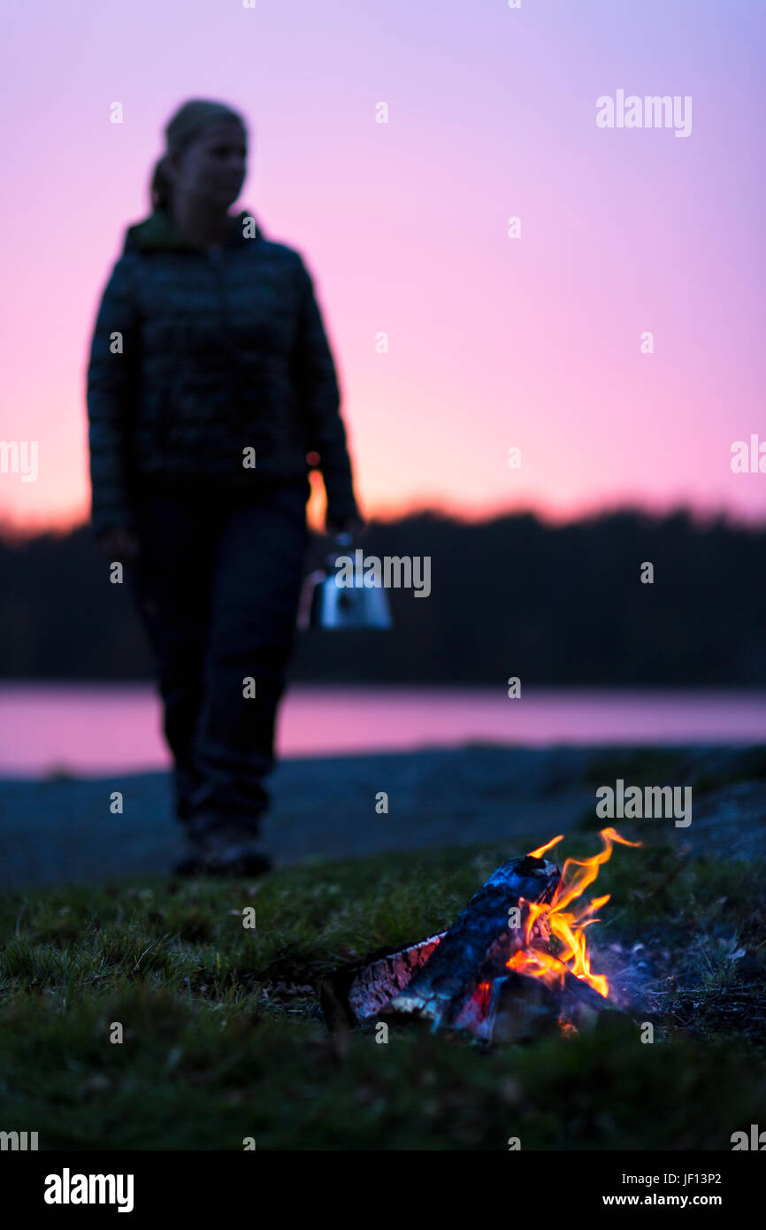 Campfire, woman on background Stock Photo - Alamy