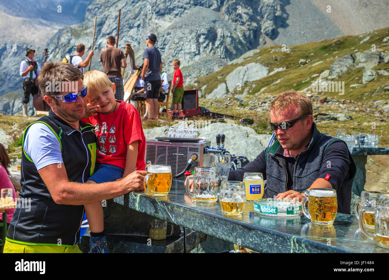 People drinking beer during an Alpine concert Stock Photo - Alamy