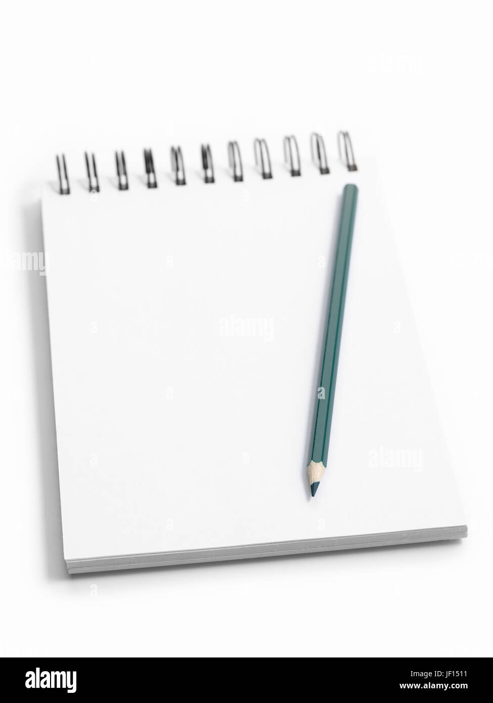 Spiral notebook and pencil Stock Photo - Alamy
