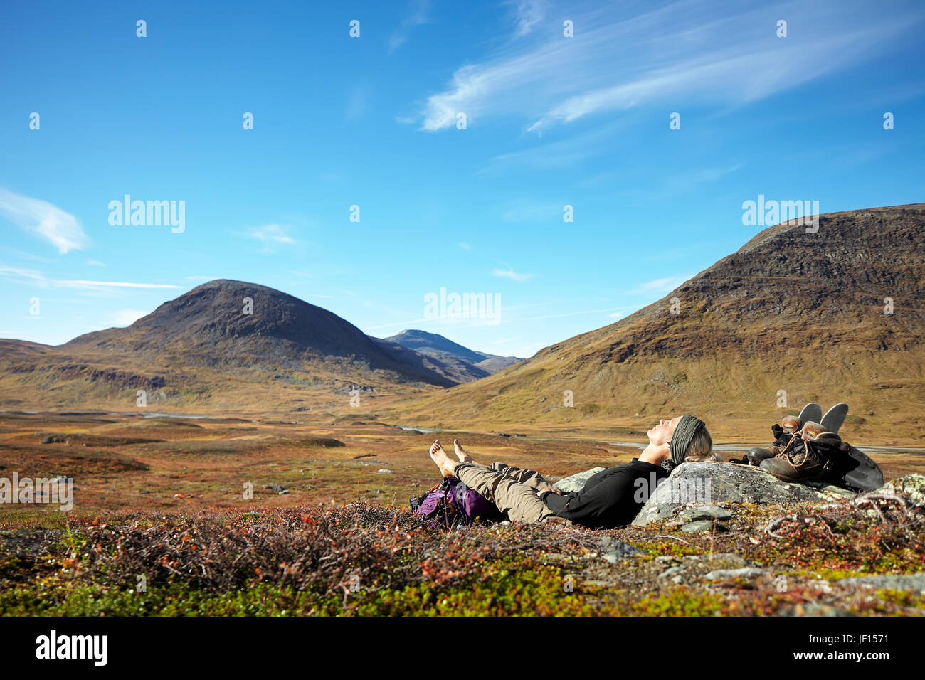 Woman relaxing in mountains hi-res stock photography and images - Alamy