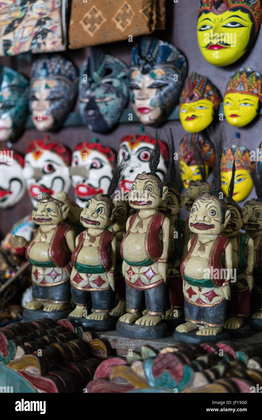 Traditional, hand-carved, wooden, Indonesian masks and souvenir statues ...