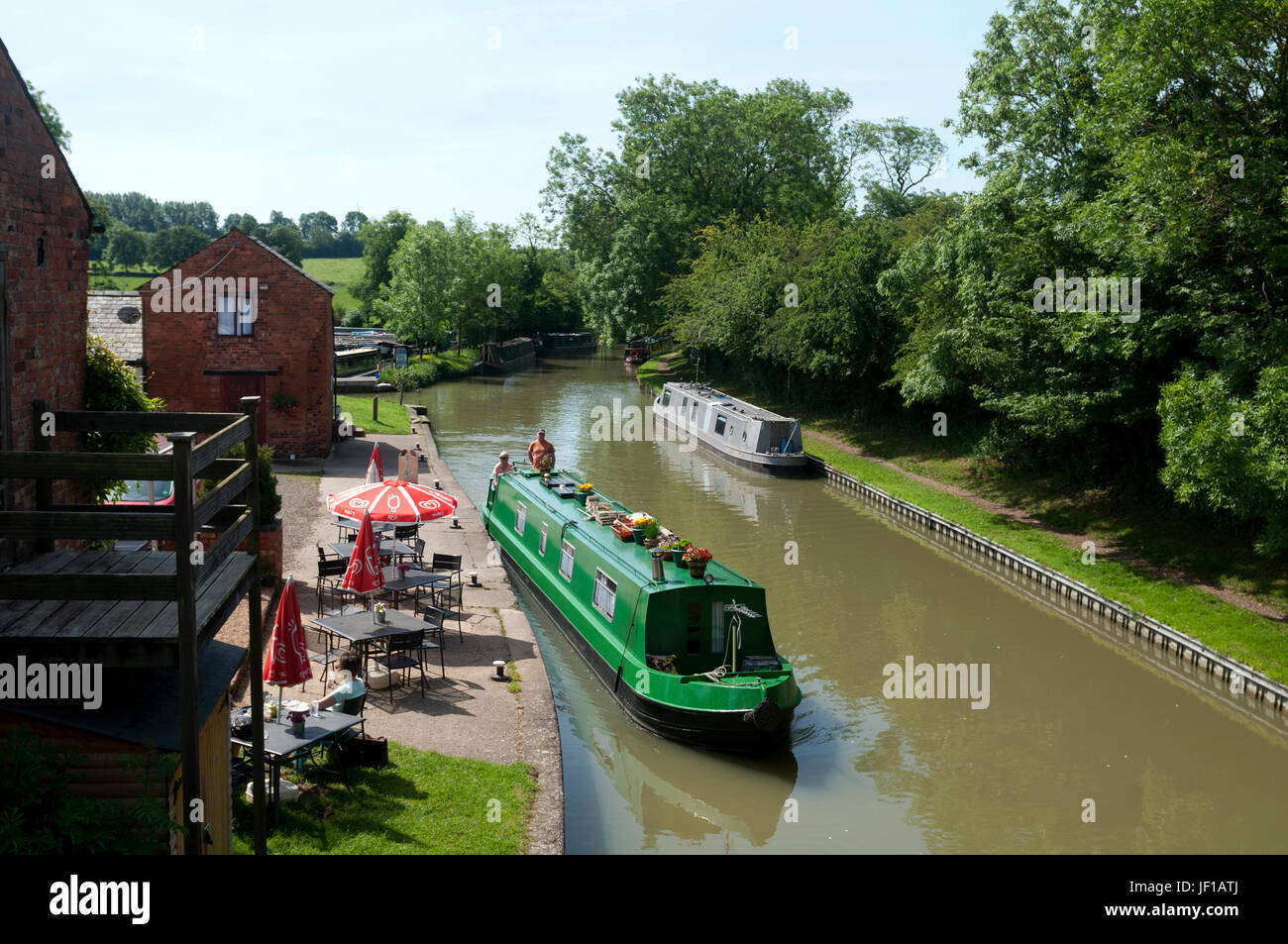 Narrowboat passing Crick Wharf, Grand Union Canal, Northamptonshire ...