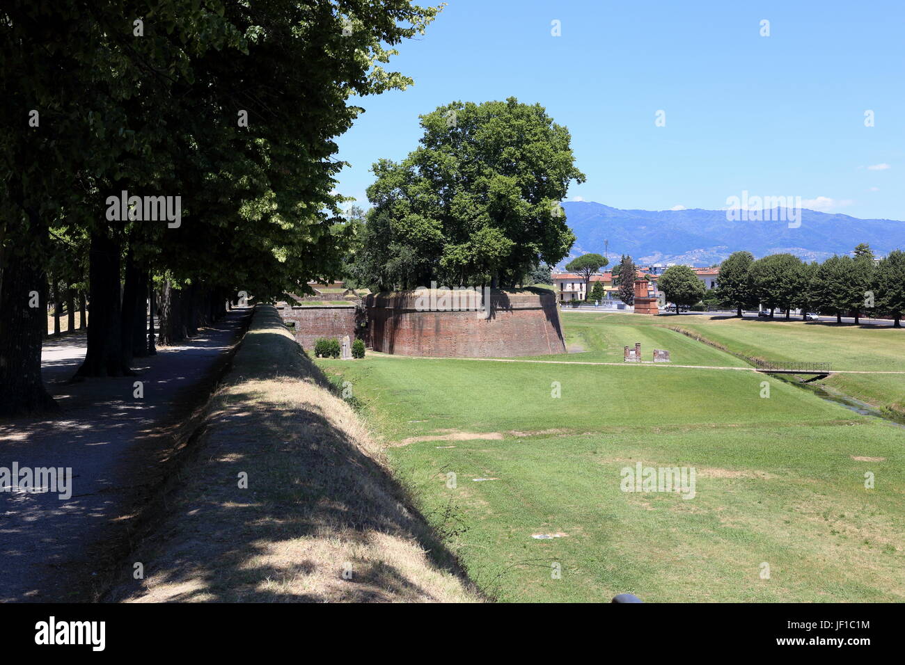 The historic city walls of Lucca, Italy and the parkland surrounding ...