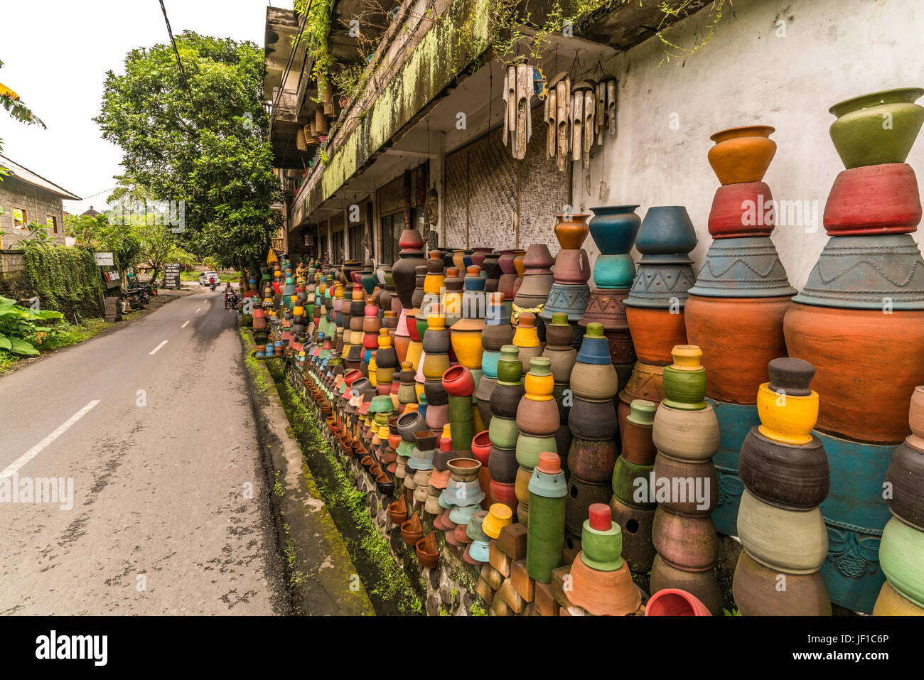 Roadside display of colourful pottery craftsmanship in Ubud, Bali Stock ...