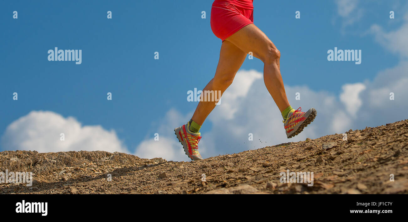 Detail of woman's legs walking athlete in mountain Stock Photo - Alamy