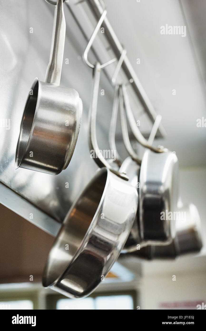 Hanging pans in kitchen hi-res stock photography and images - Alamy