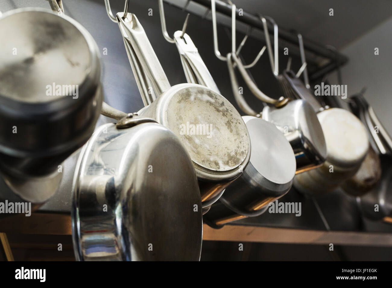 Hanging pans in kitchen hi-res stock photography and images - Alamy