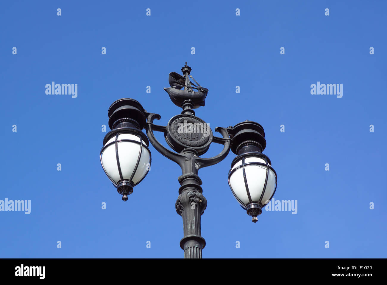 old classic urban public lighting and blue sky Stock Photo - Alamy