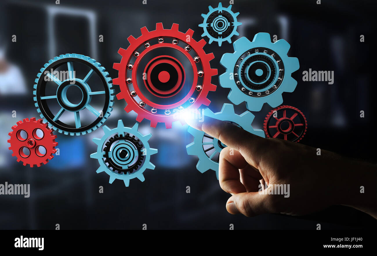 Businessman on blurred background touching floating gear icons with his ...