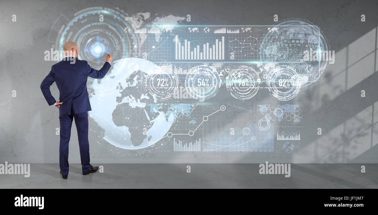 Businessman in modern interior using graph screens interface on a wall ...