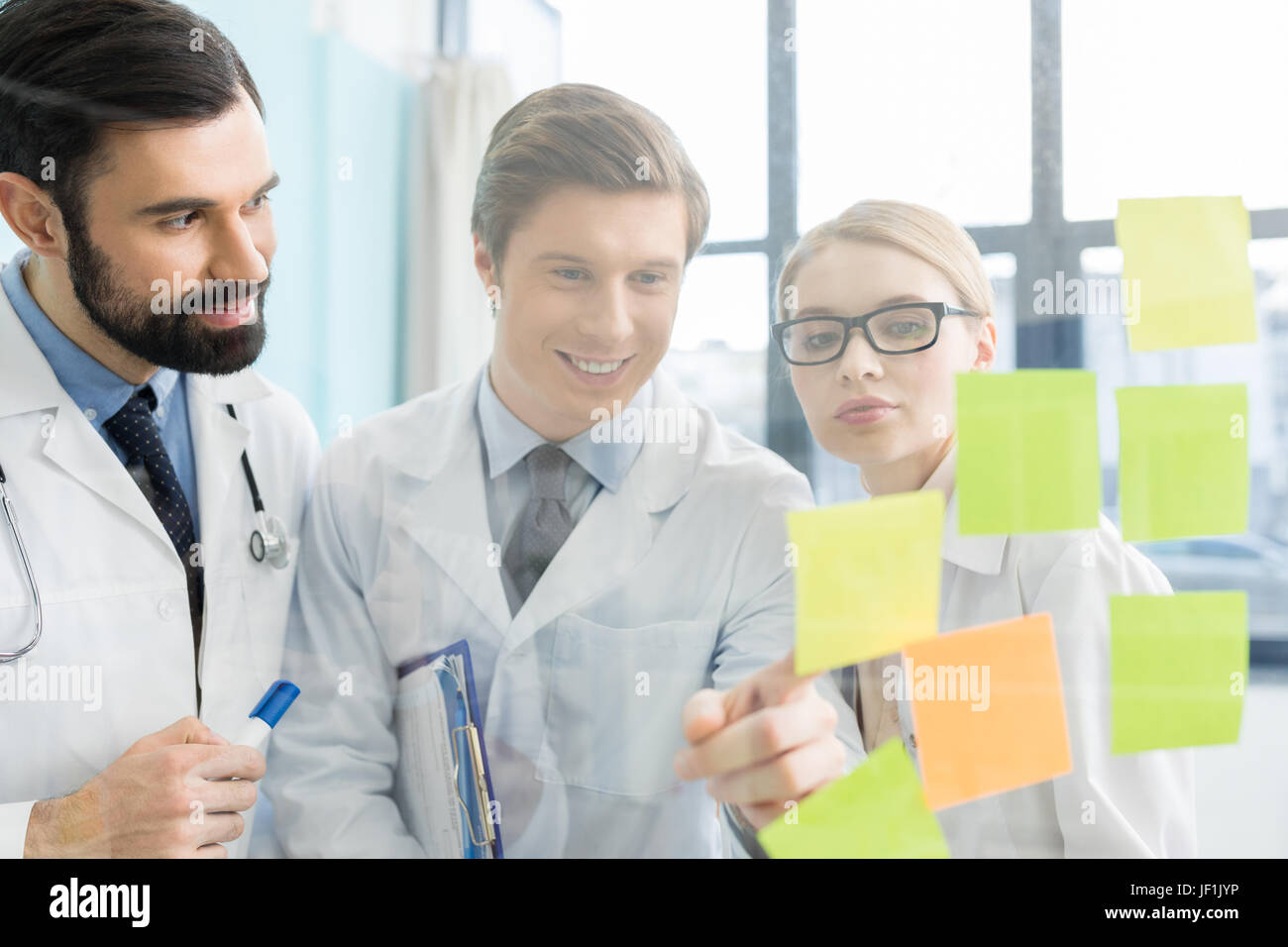 group of professional doctors having work meeting in clinic Stock Photo ...