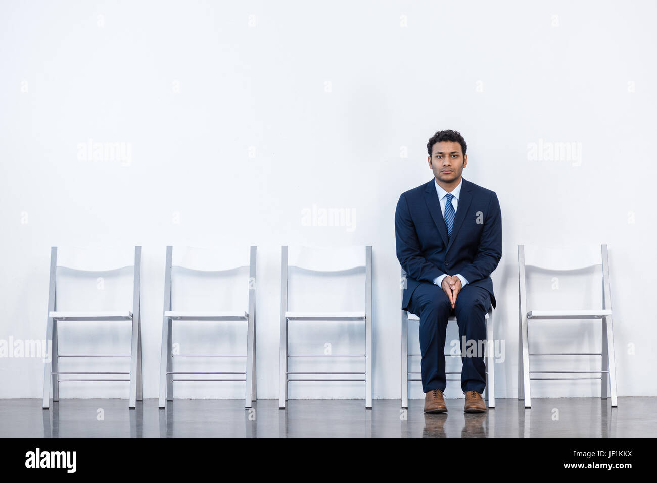 Person sitting on chair interview hi-res stock photography and images ...