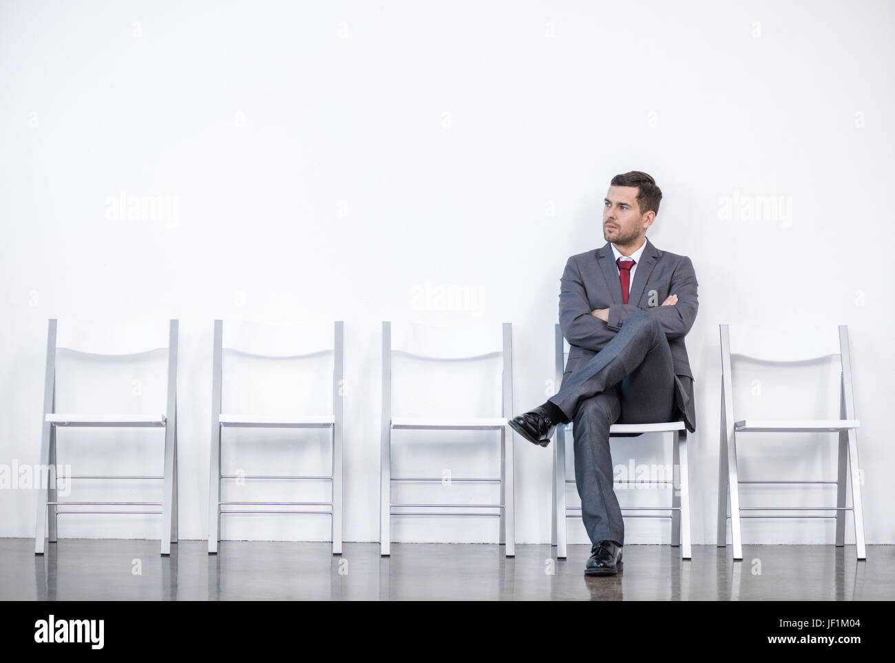 businessman sitting and waiting for interview in office, business ...