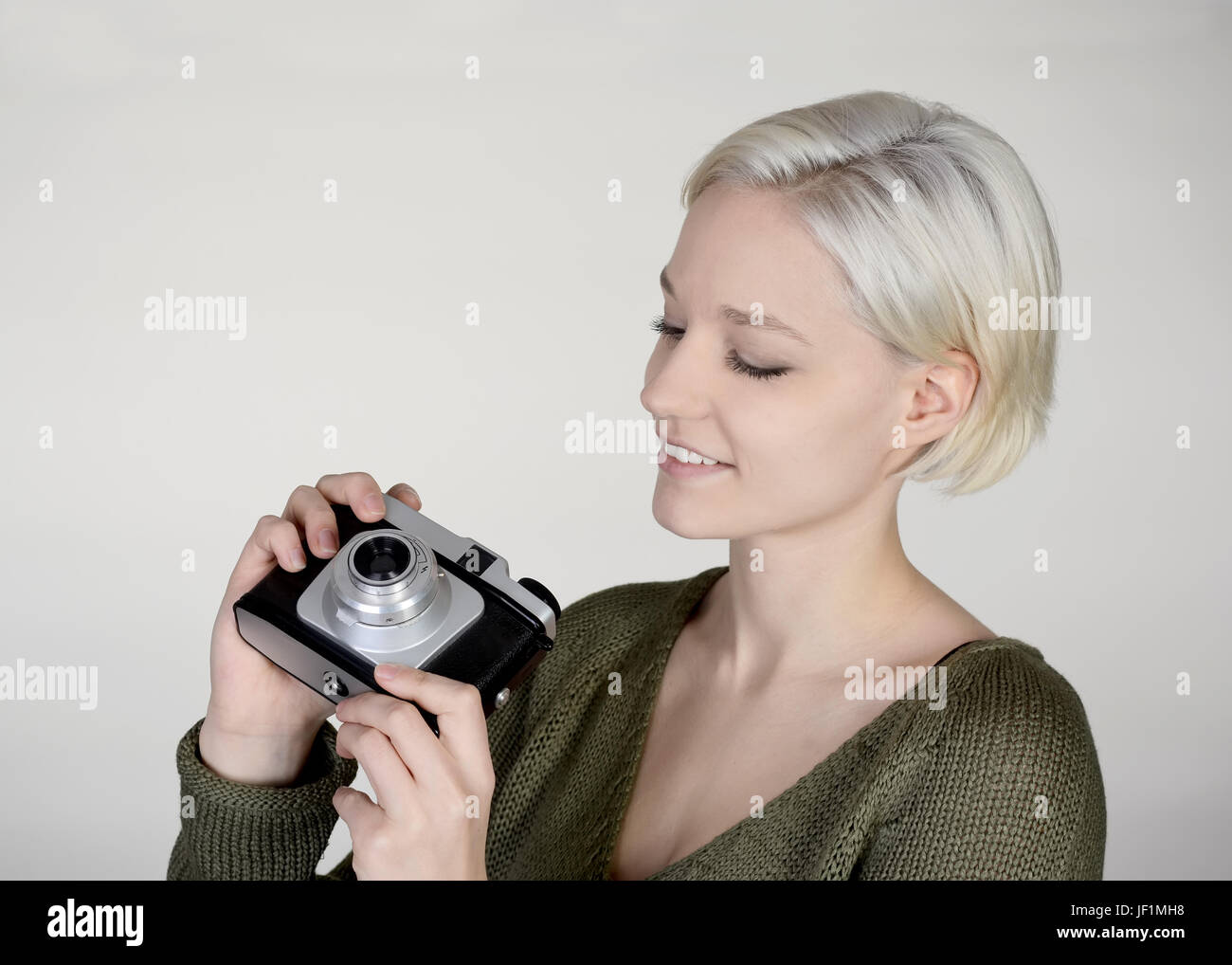 young woman with old camera Stock Photo - Alamy