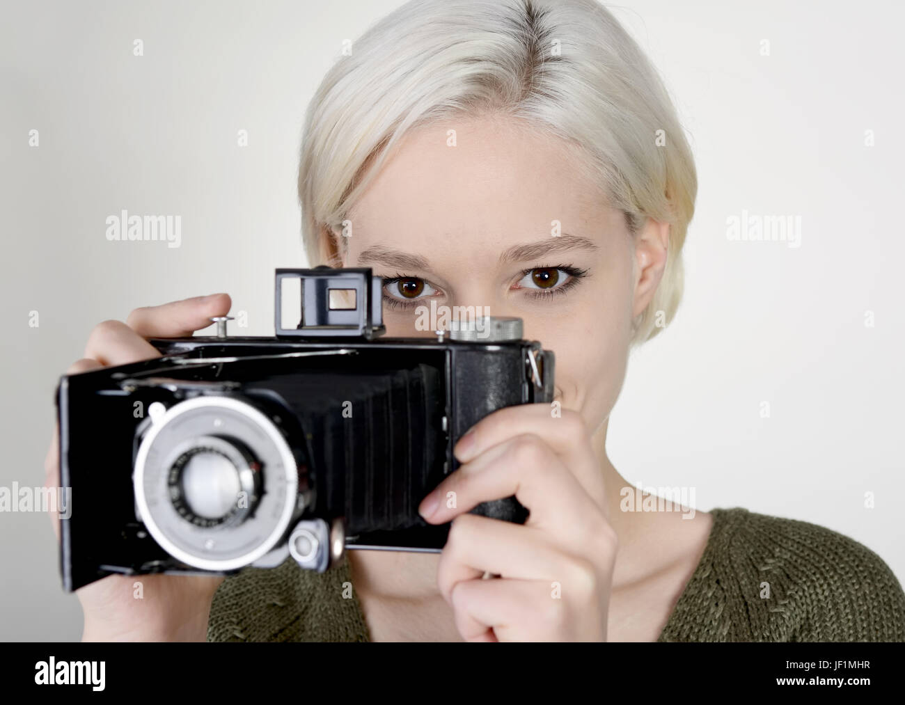 young woman with old camera Stock Photo - Alamy