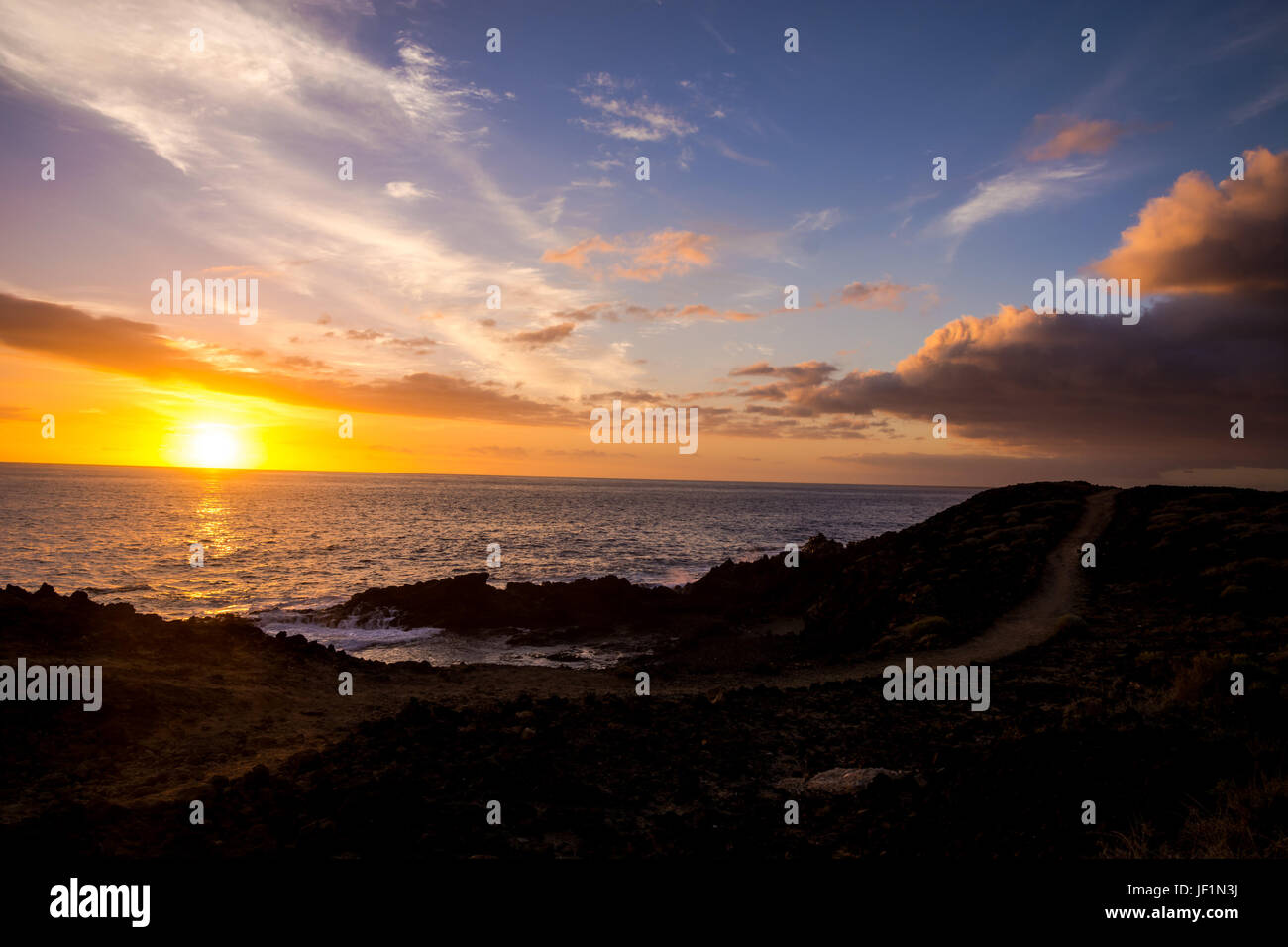 Sun Setting on the Ocean Stock Photo - Alamy
