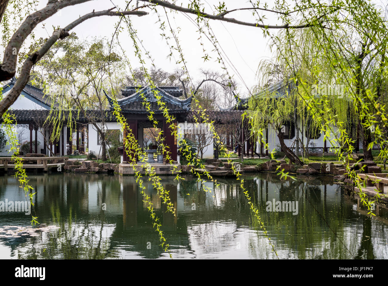 Keyuan Garden, a traditional Chinese garden with a pond and surrounding ...