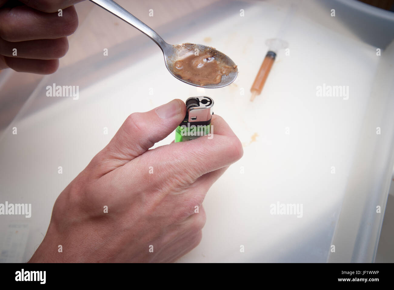 drugs and substance abuse, cooked heroin and syringe Stock Photo - Alamy
