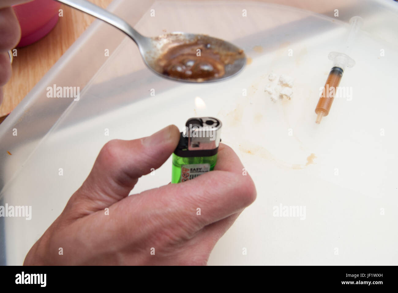 drugs and substance abuse, cooked heroin and syringe Stock Photo - Alamy