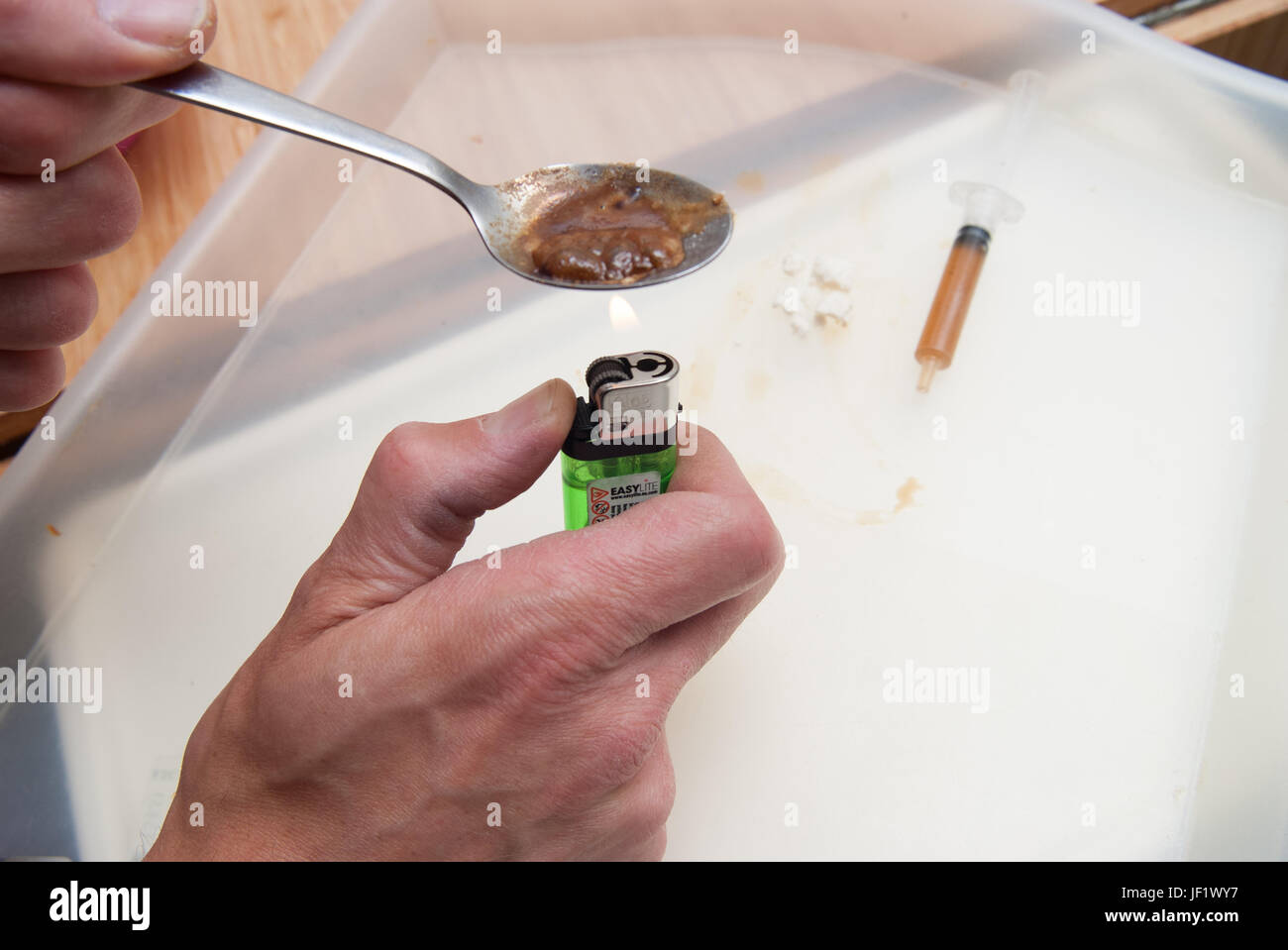 drugs and substance abuse, cooked heroin and syringe Stock Photo - Alamy