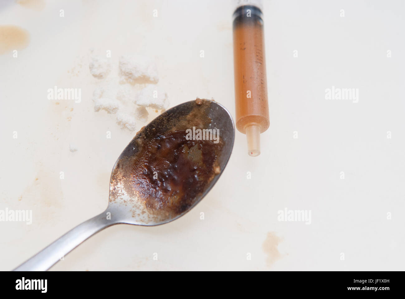 drugs and substance abuse, cooked heroin and syringe Stock Photo - Alamy