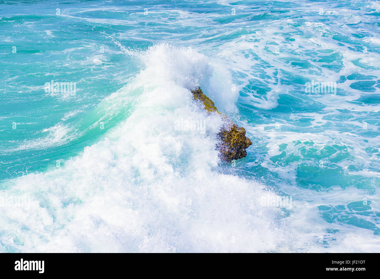 Wave Hitting a Rock Stock Photo - Alamy